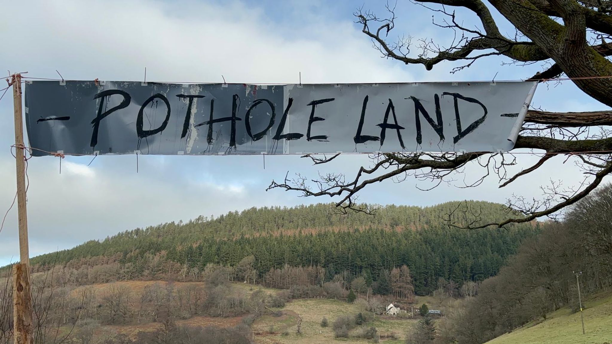 'Pothole Land': Residents of Wrexham village turn road into tourist ...