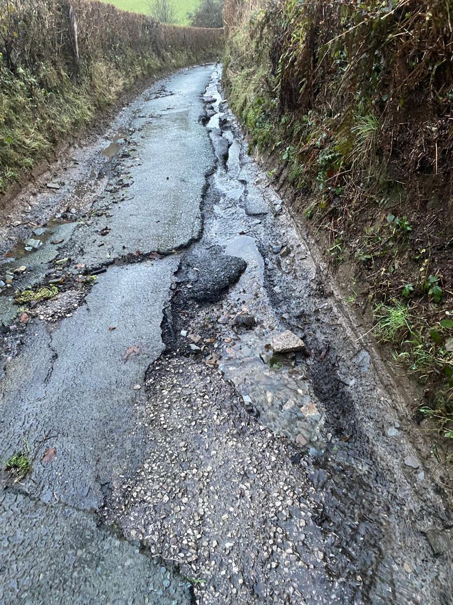 'Pothole Land': Residents of Wrexham village turn road into tourist ...