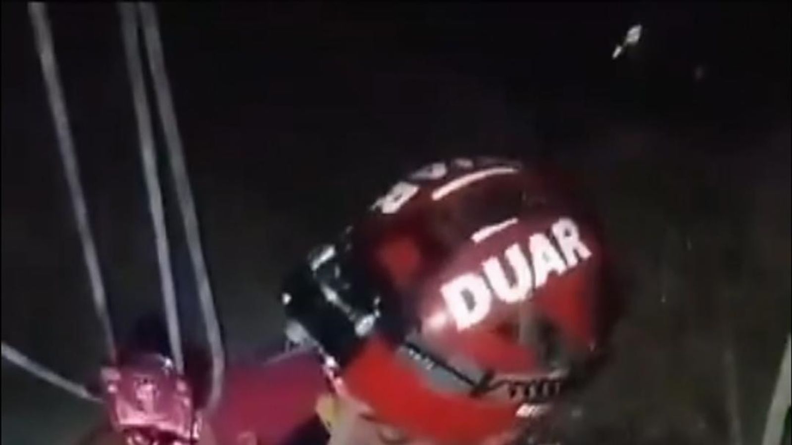 Emergency crews rescue a small dog after he fell into a deep well in ...