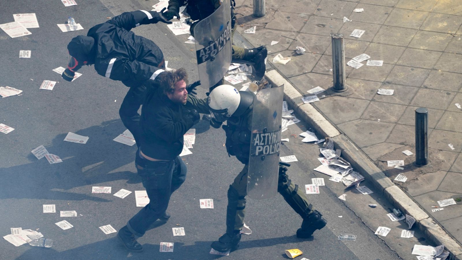 Protesters hurl petrol bombs and police fire tear gas as demonstration ...