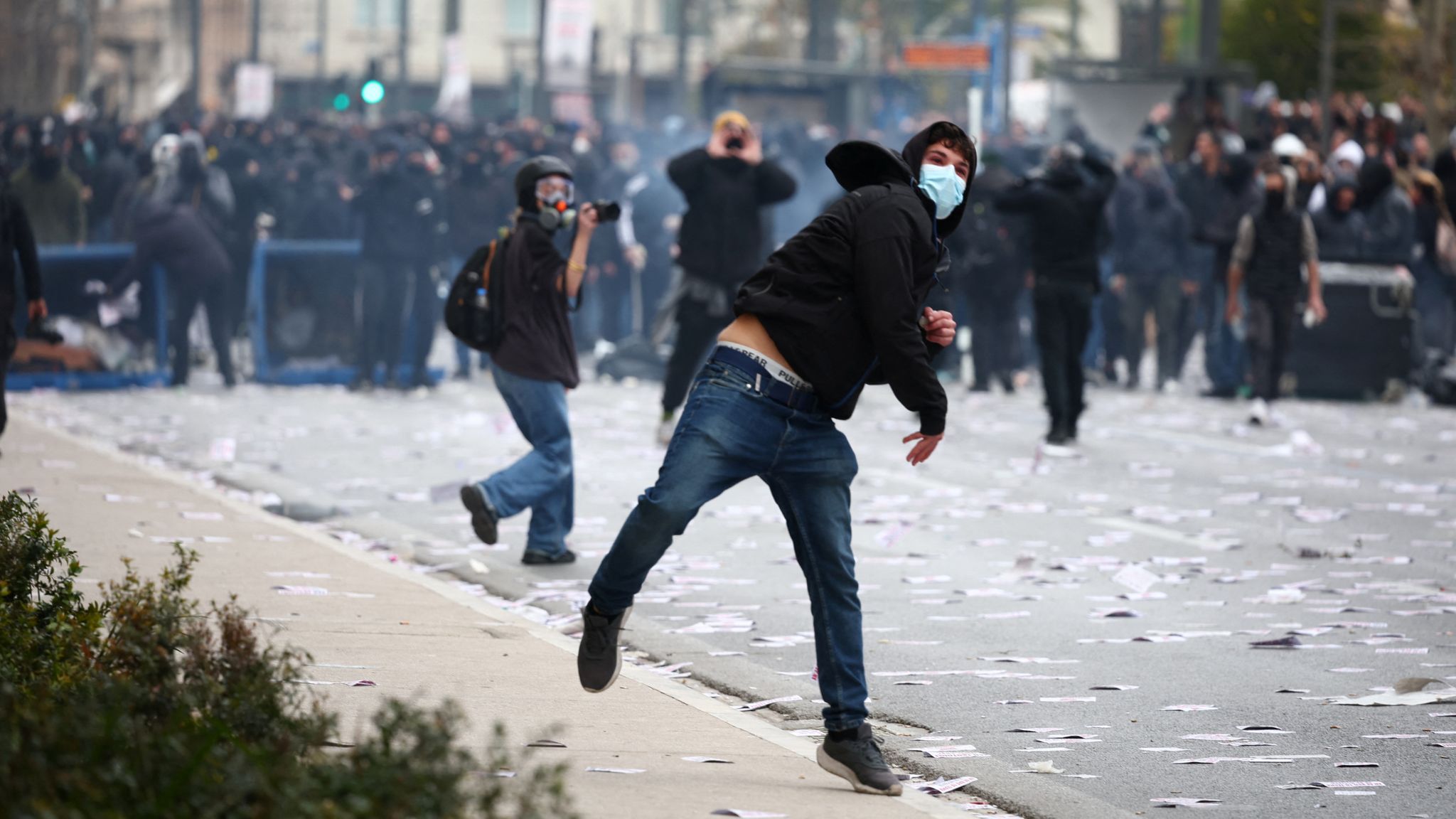 Protesters hurl petrol bombs and police fire tear gas as demonstration ...