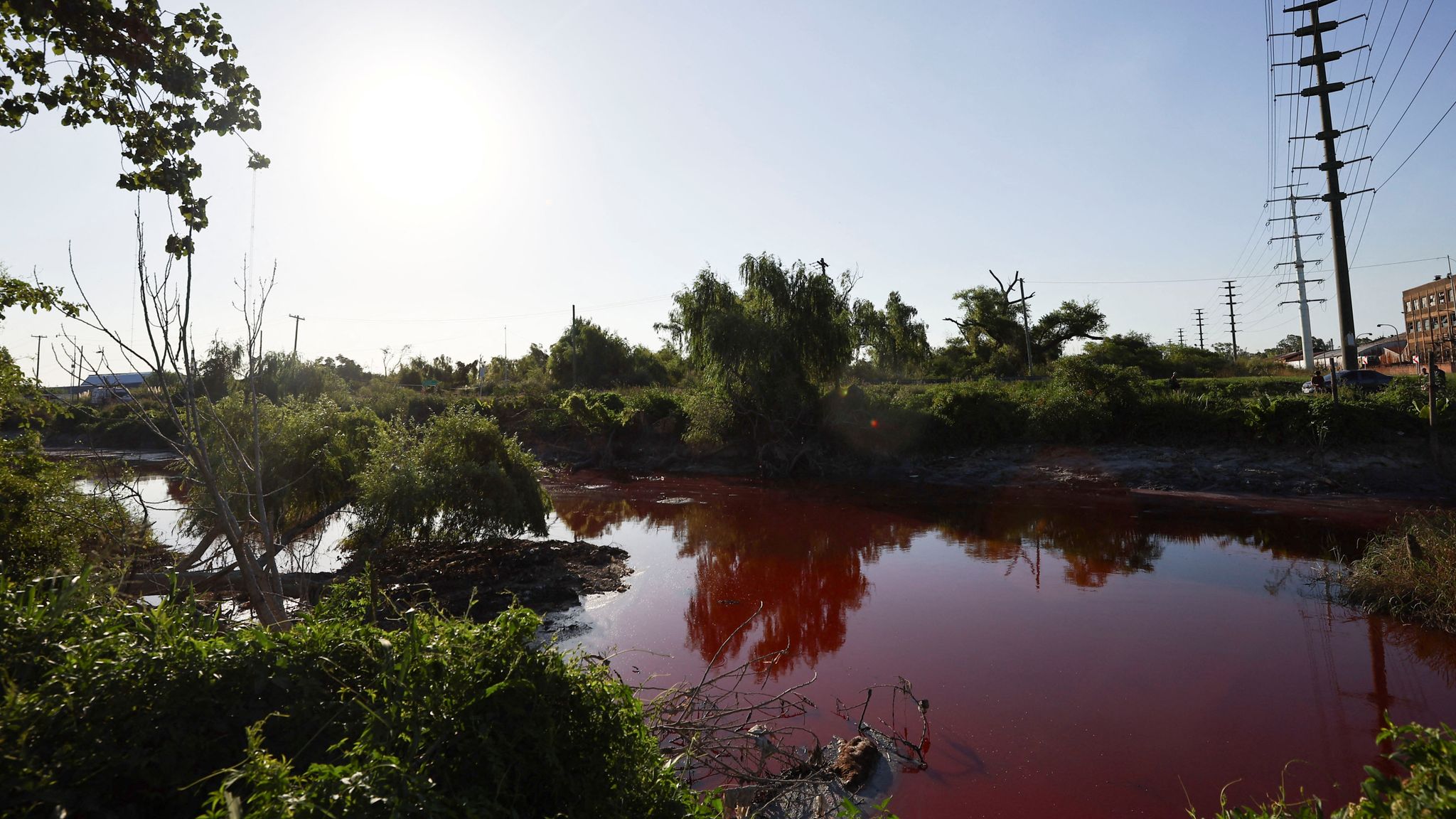 River in Argentina turns bright red | World News | Sky News