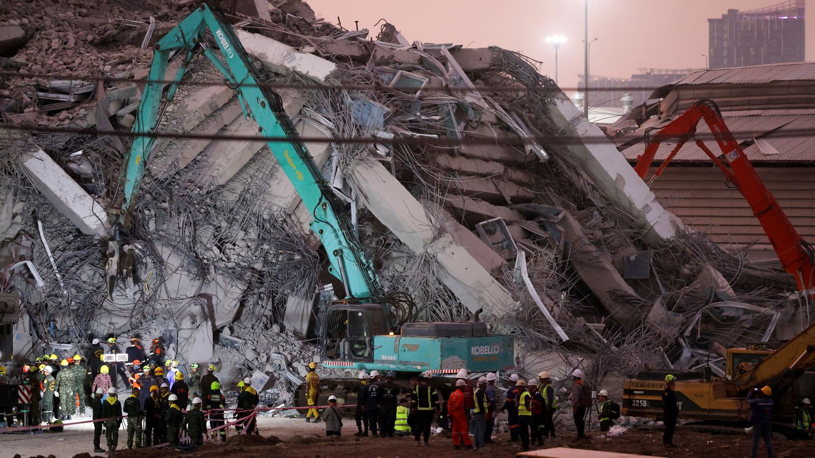 Families of those trapped in rubble of collapsed Bangkok building after ...