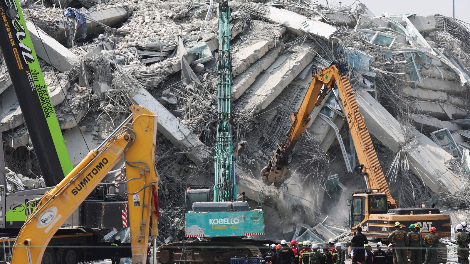 Families of those trapped in rubble of collapsed Bangkok building after ...