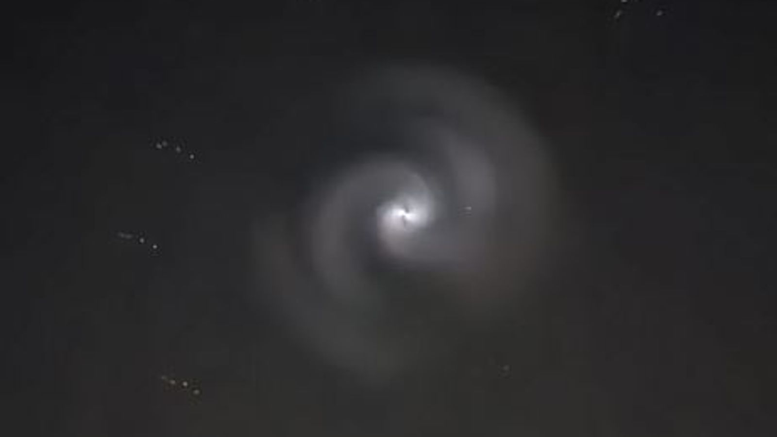 Glowing spiral appears in night sky - as Met Office reveals likely ...