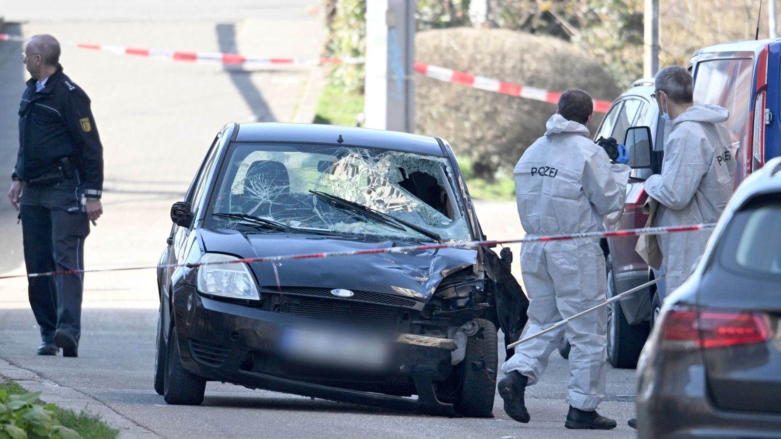 Two dead, 11 injured, as driver rams car into crowds then shoots ...