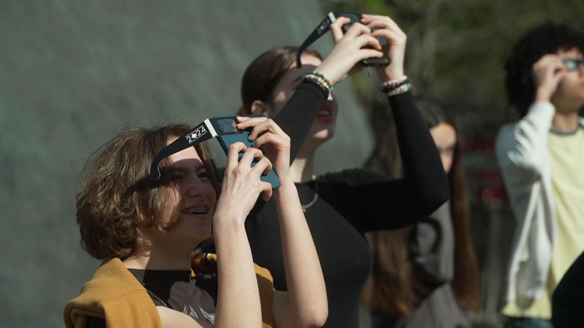Eclipse chasers in awe as moon takes a nibble from the sun | Science ...