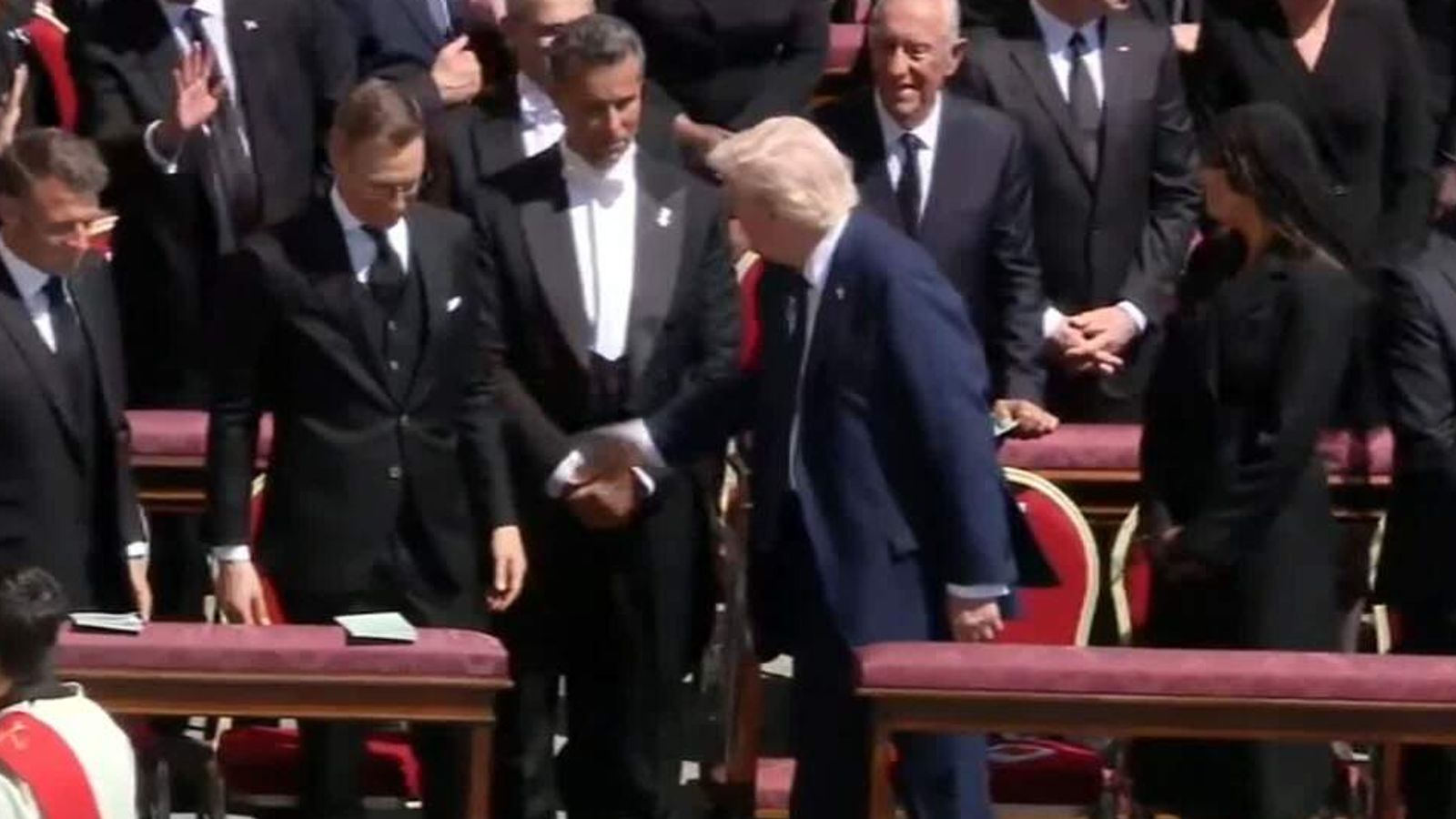 Trump and Macron take part in 'sign of peace' | World News | Sky News