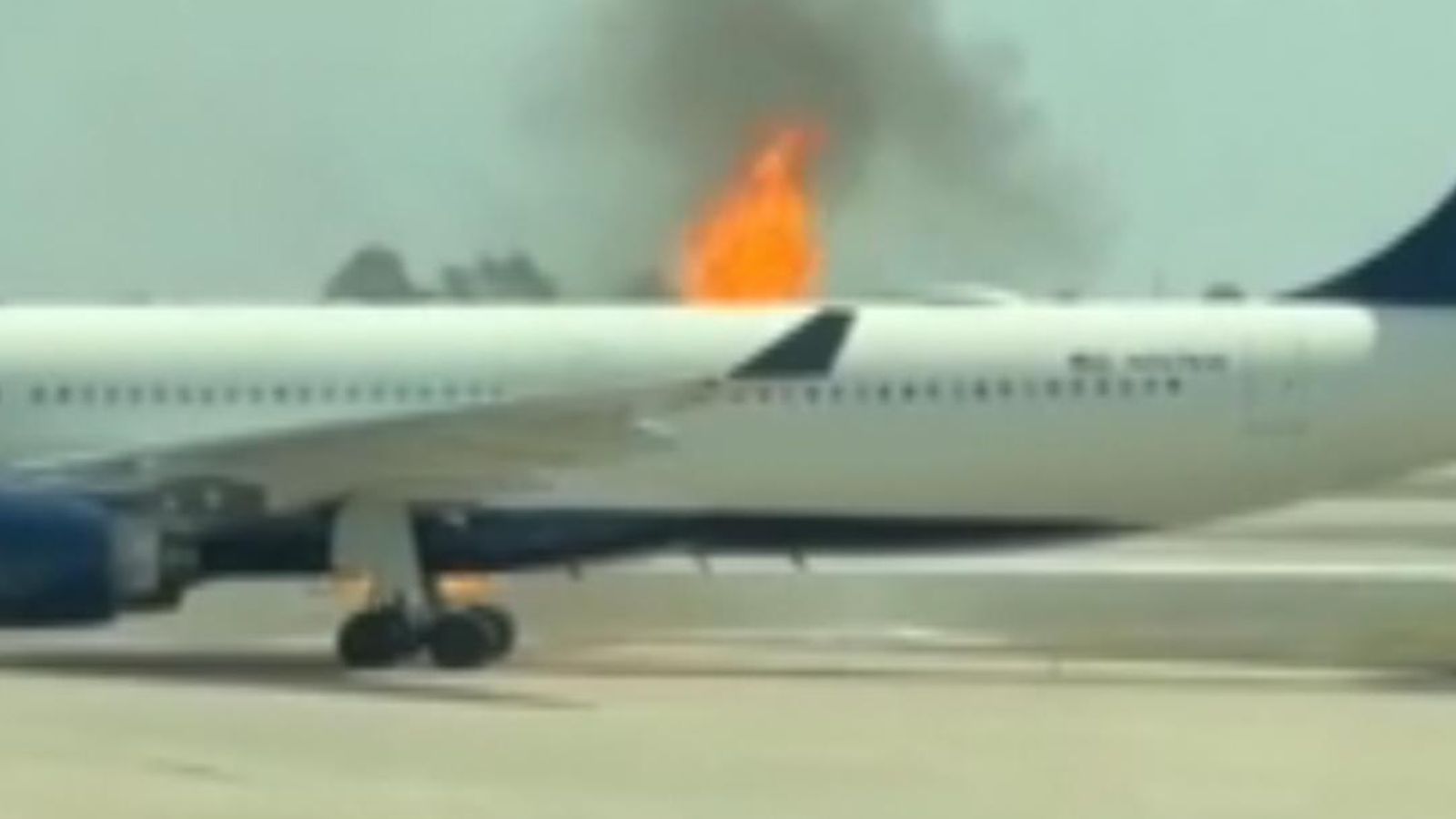 Passenger plane evacuated as fire breaks out on runway | US News | Sky News