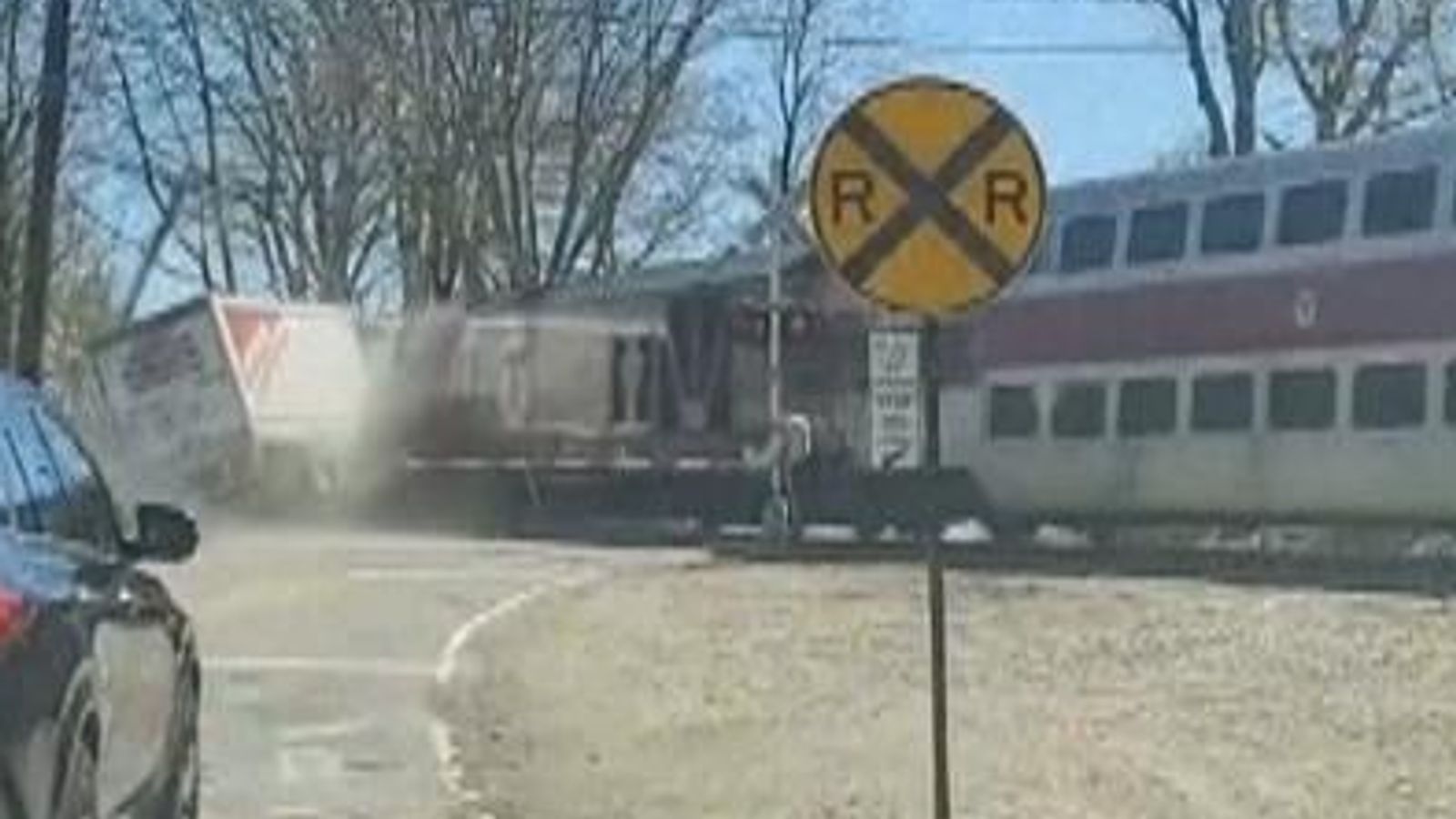Moment commuter train slams into lorry sitting on tracks in ...