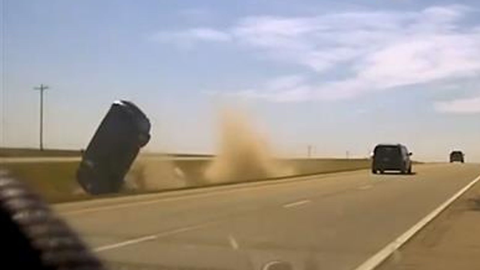 Moment car suddenly flips over on busy road in Kansas | US News | Sky News