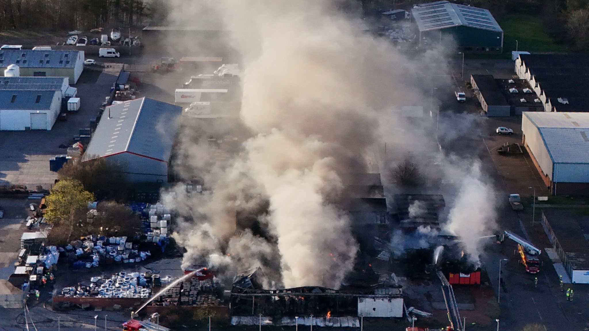 Six people in hospital after huge fire at industrial estate in ...