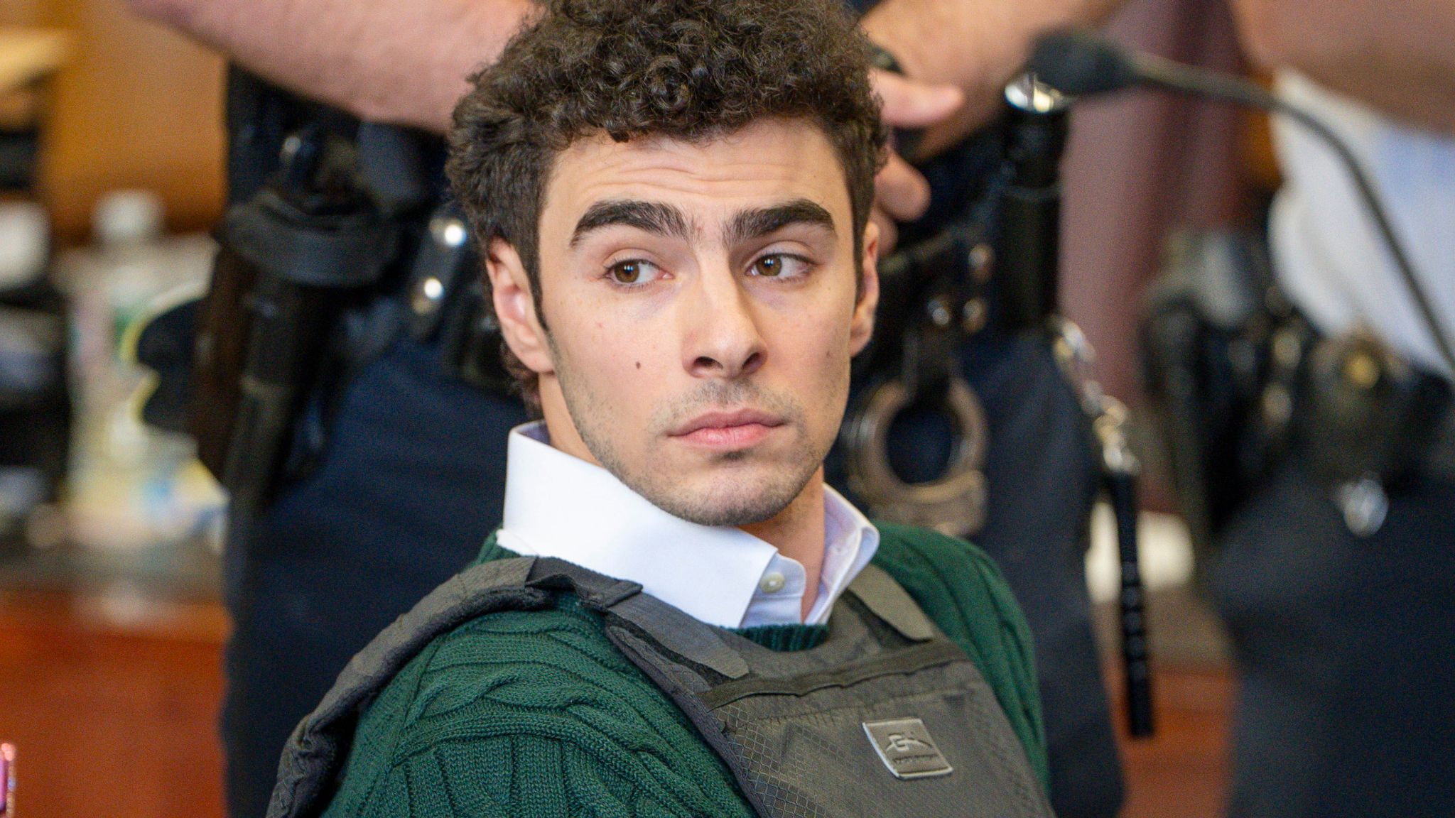 Luigi Mangione pleads not guilty to murder of healthcare boss - as death penalty bid confirmed ...