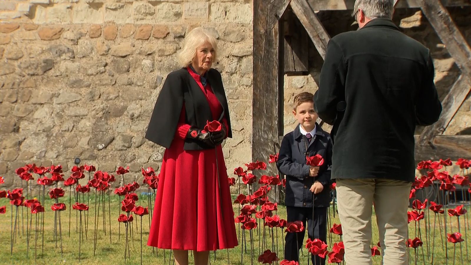 Queen Camilla lays poppy at Tower of London as part of VE Day ...
