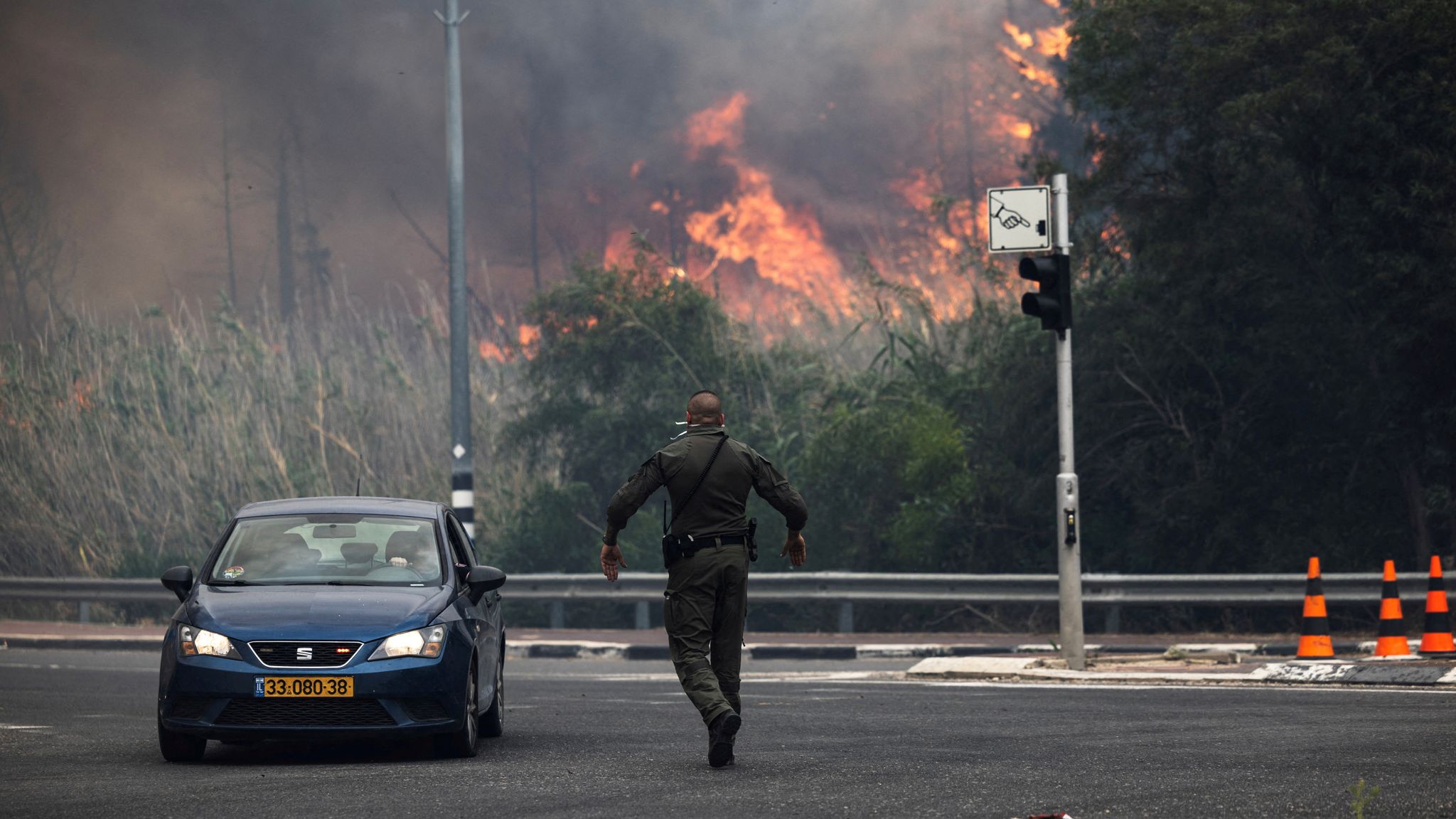 Wildfire in Israel burns 5,000 acres as drivers forced to flee cars ...