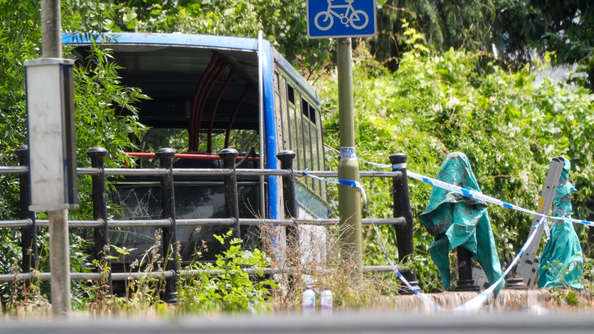 Five people taken to hospital after double-decker bus carrying students crashes into river in ...
