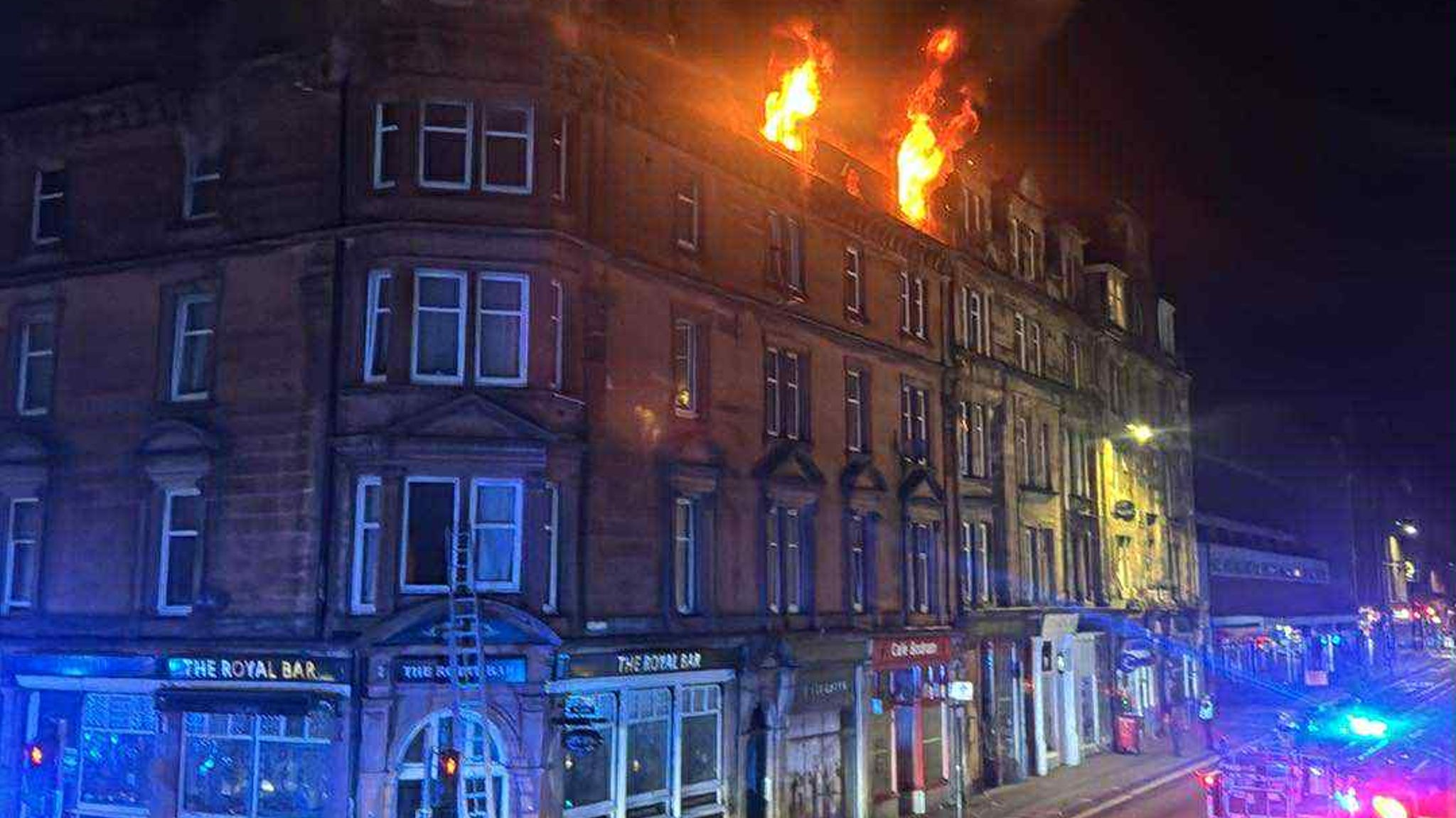 Man dies and girl, 8, in hospital after fire at four-storey building in ...