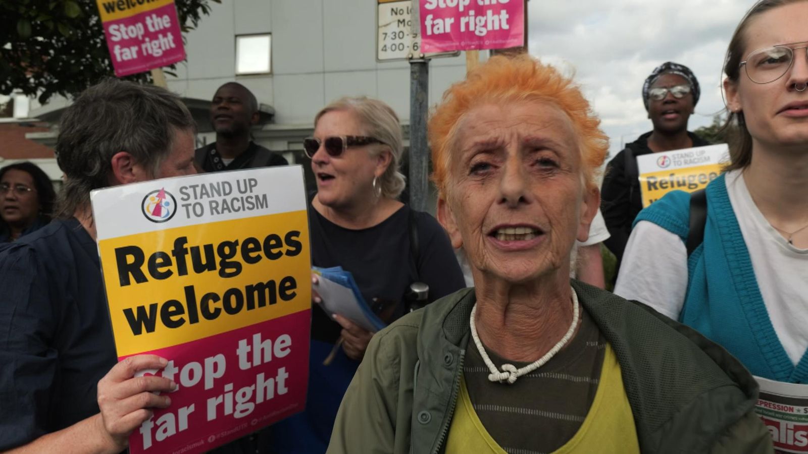 Protesters argue over immigration from either side of a dual ...