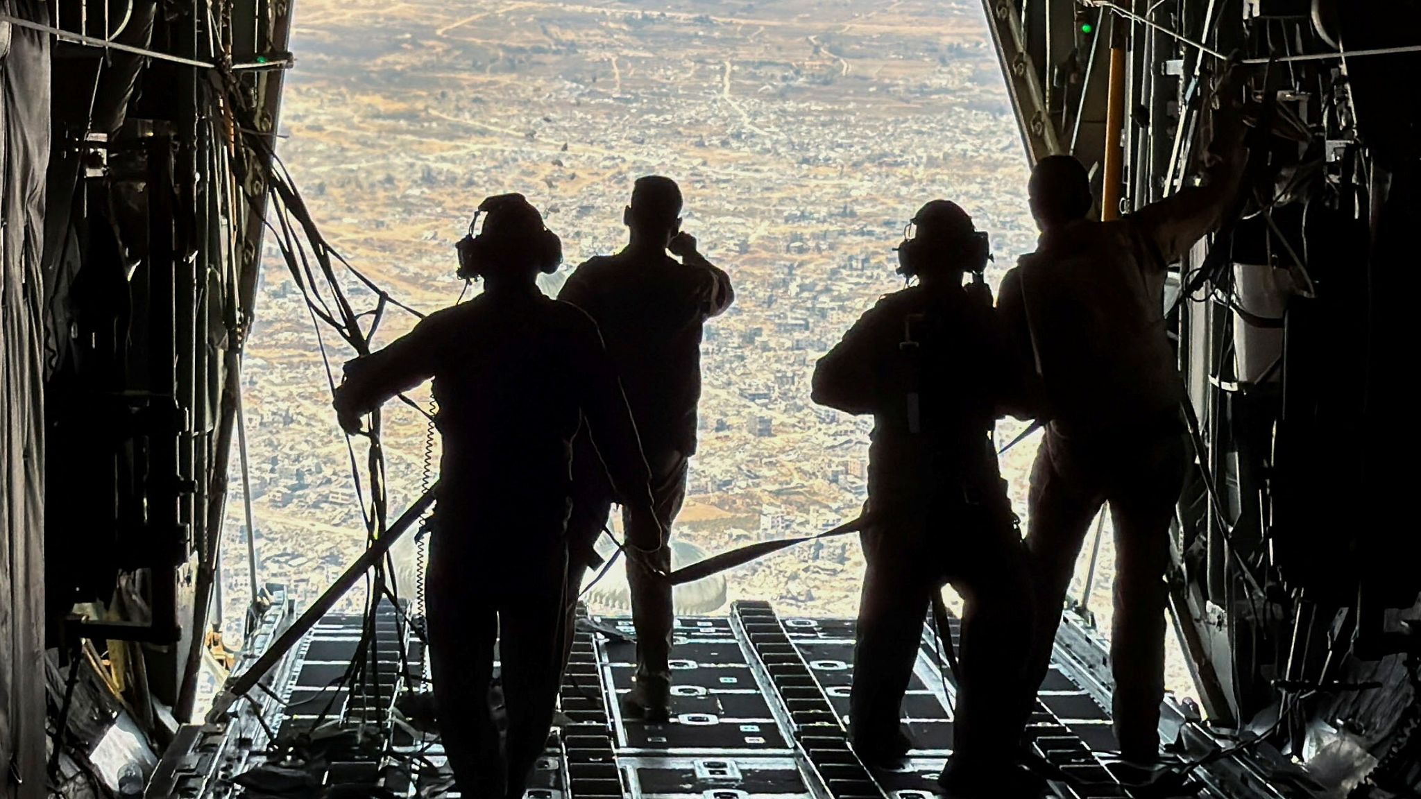 Mile after mile of grey rubble - the view from a plane dropping aid to ...