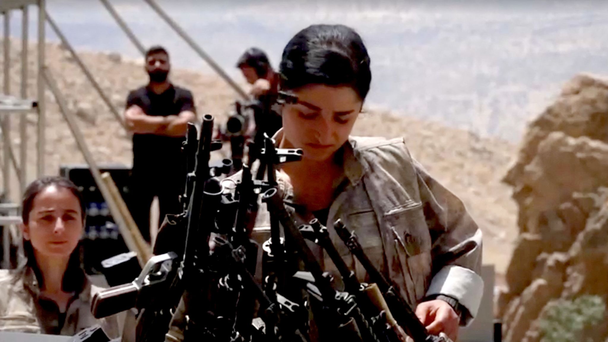Kurdish fighters burn weapons in significant step towards peace with ...