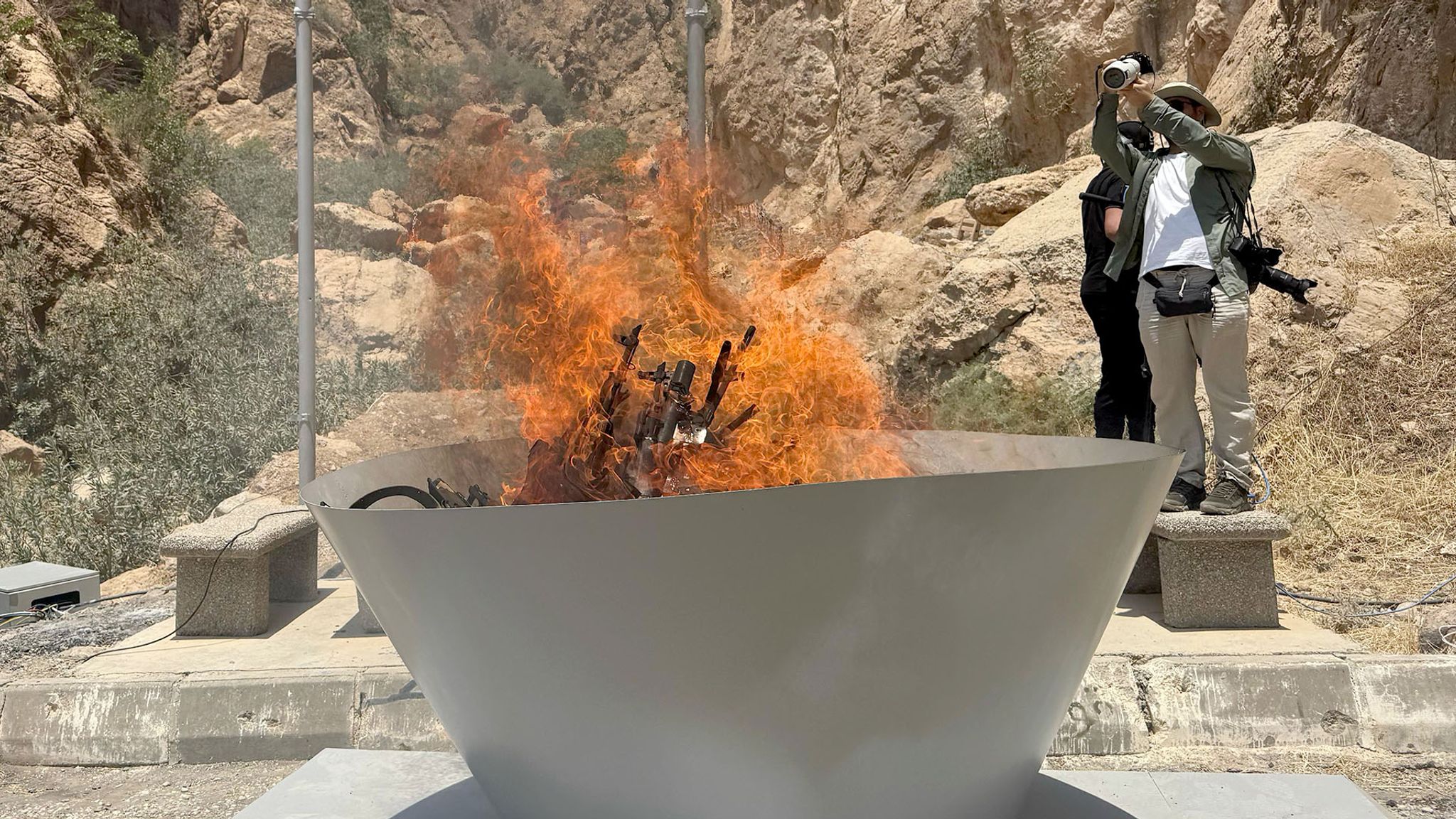 Kurdish fighters burn weapons in significant step towards peace with ...