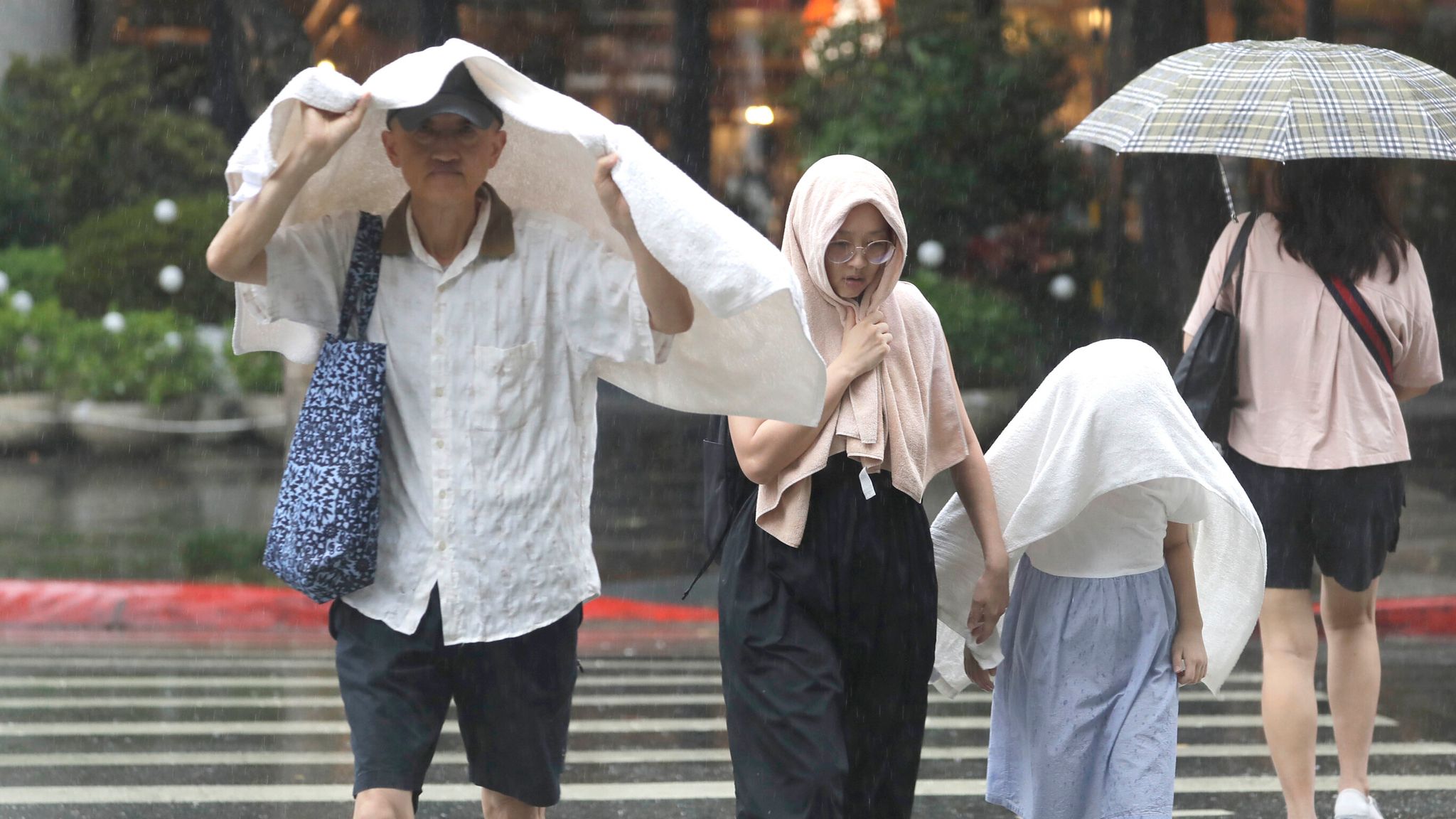 Typhoon Danas: Two people killed and hundreds injured as 135mph winds ...