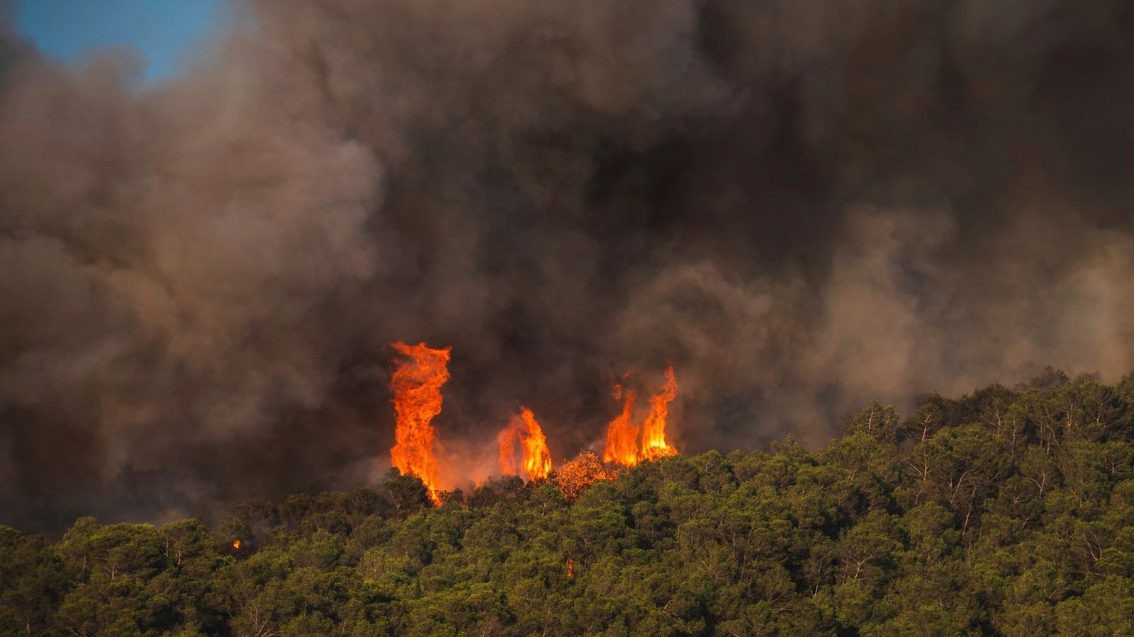One dead as 'hellish' wildfire burns across area the size of Paris in ...