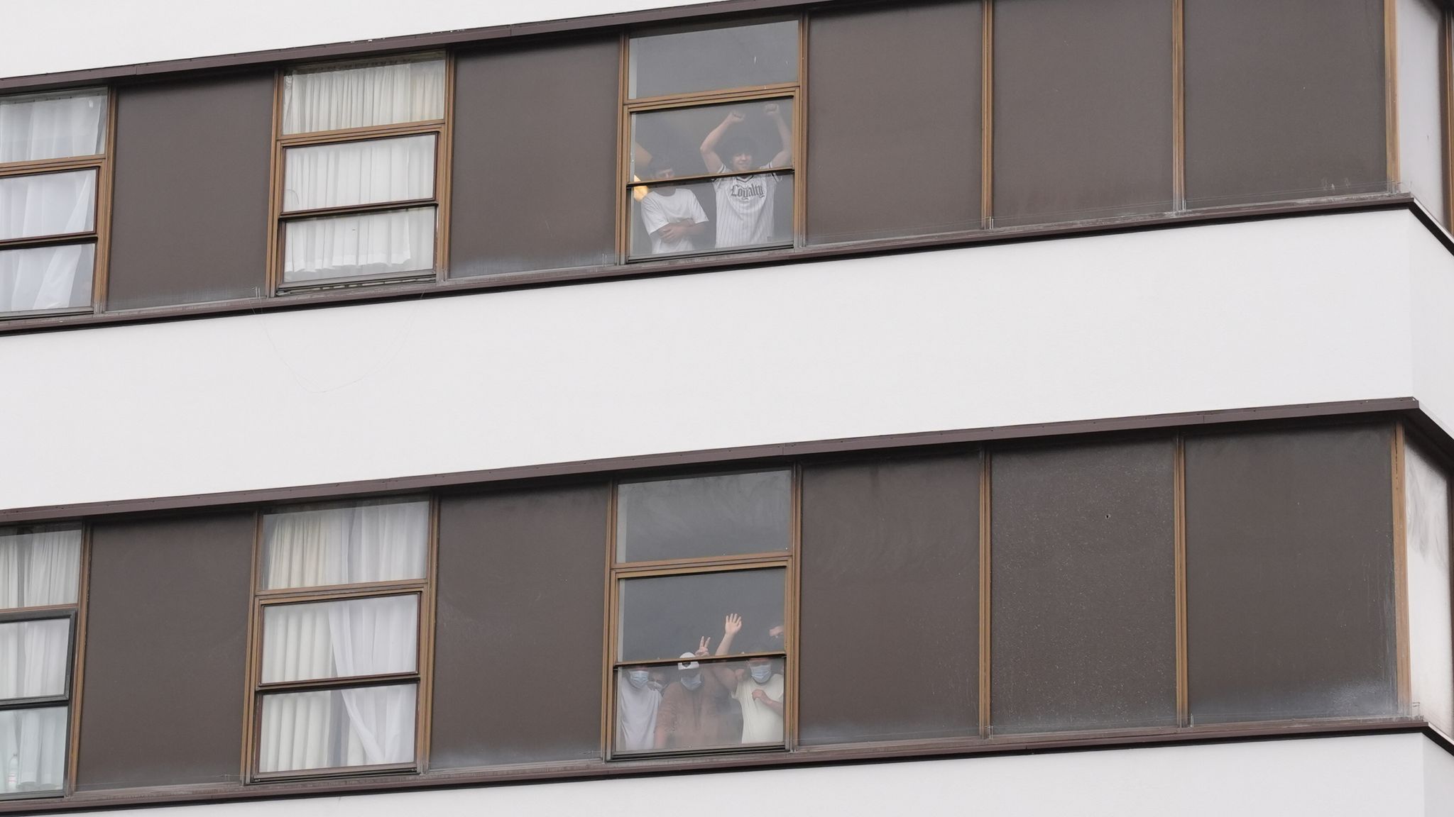Rival groups face off outside migrant hotel - as asylum seekers 'blow ...