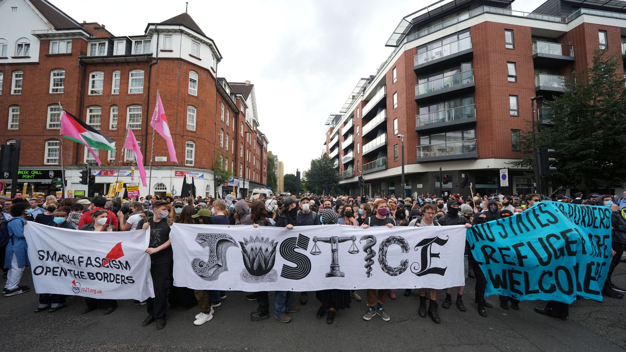 Rival groups face off outside migrant hotel - as asylum seekers 'blow ...