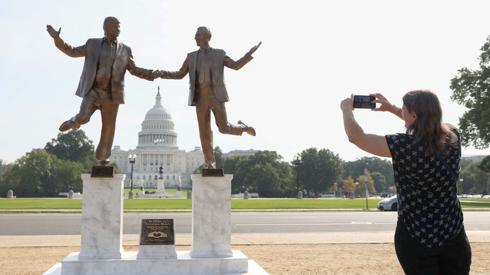 Trump and Epstein hold hands in new statue near Capitol Hill in ...
