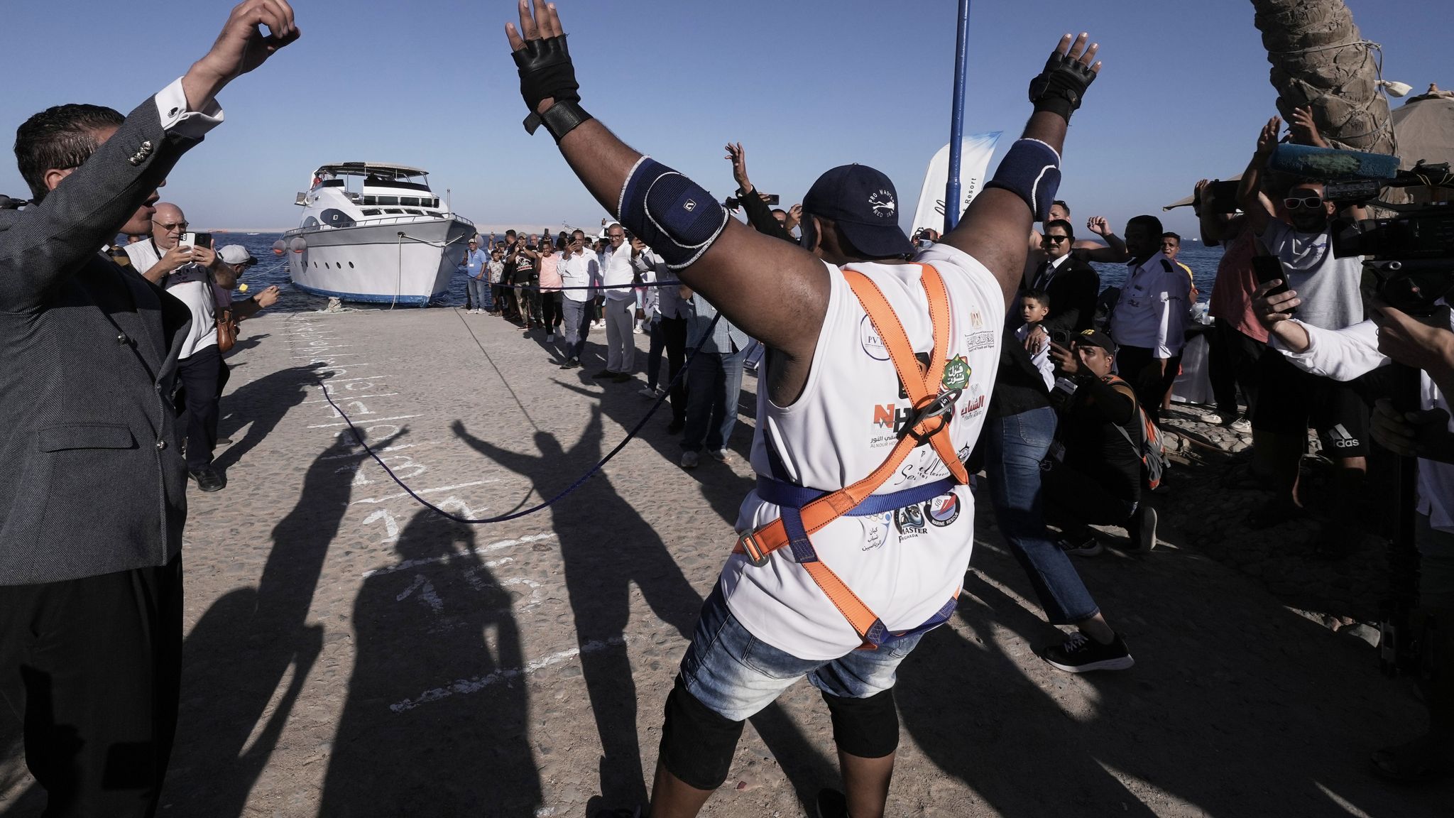 Ashraf Mahrous: Egypt's 'strongman' wrestler pulls ship using his teeth | World News | Sky News
