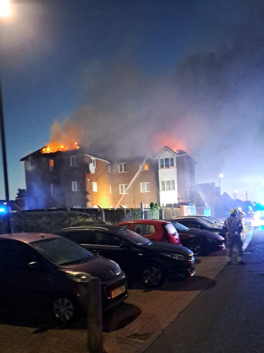 Three children taken to hospital after fire tears through three-storey ...
