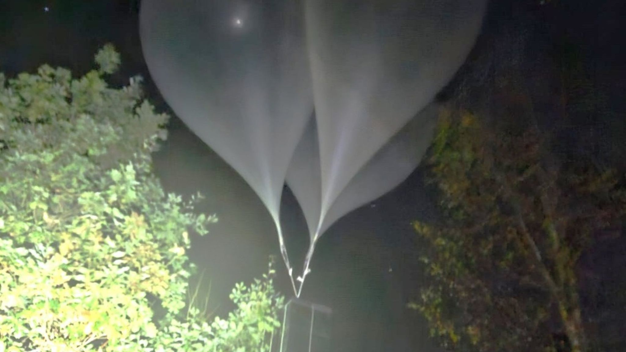 Airport halts flights after balloons used by cigarette smugglers breach ...