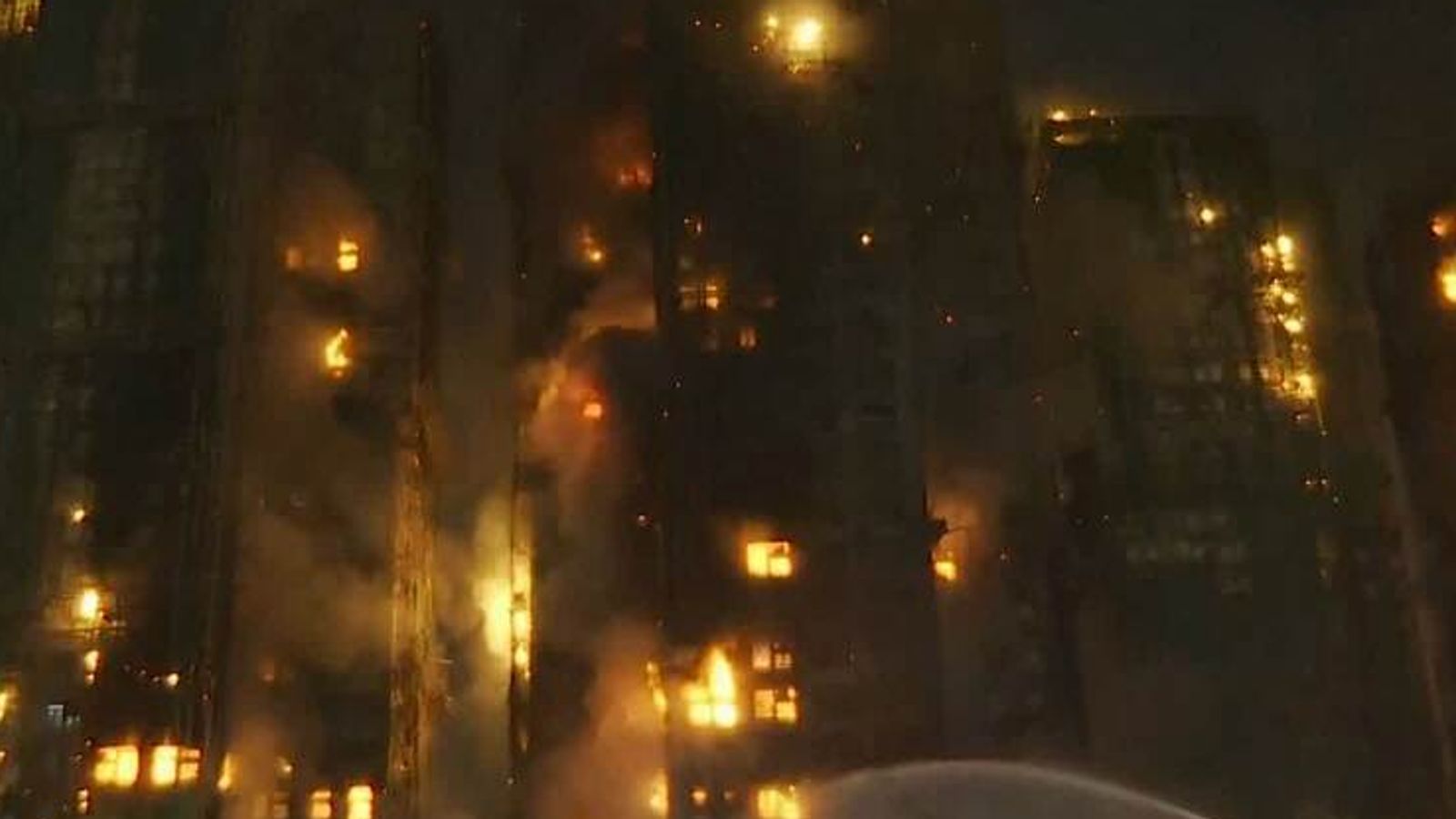 Fatal fire engulfs Hong Kong high-rise block | World News | Sky News