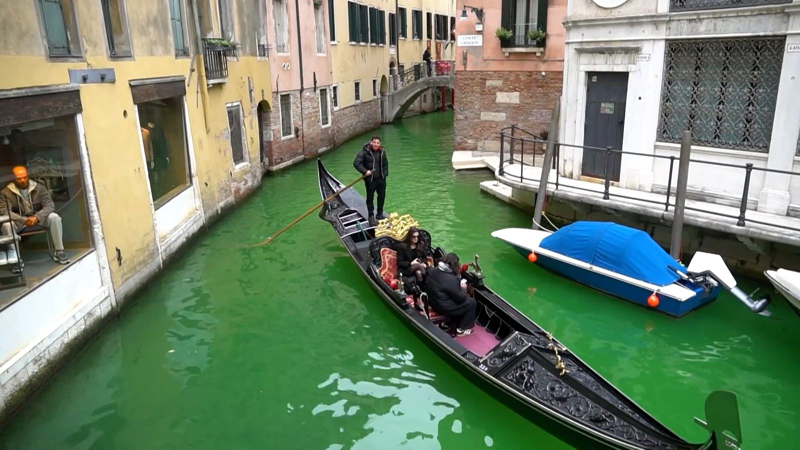 Climate activists dye Venice's Grand Canal fluorescent green | World News | Sky News