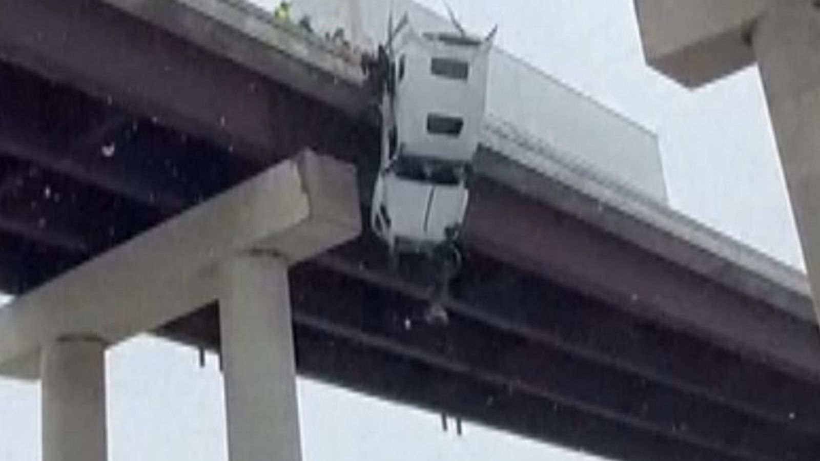 Lorry driver rescued after being suspended from bridge for hours ...