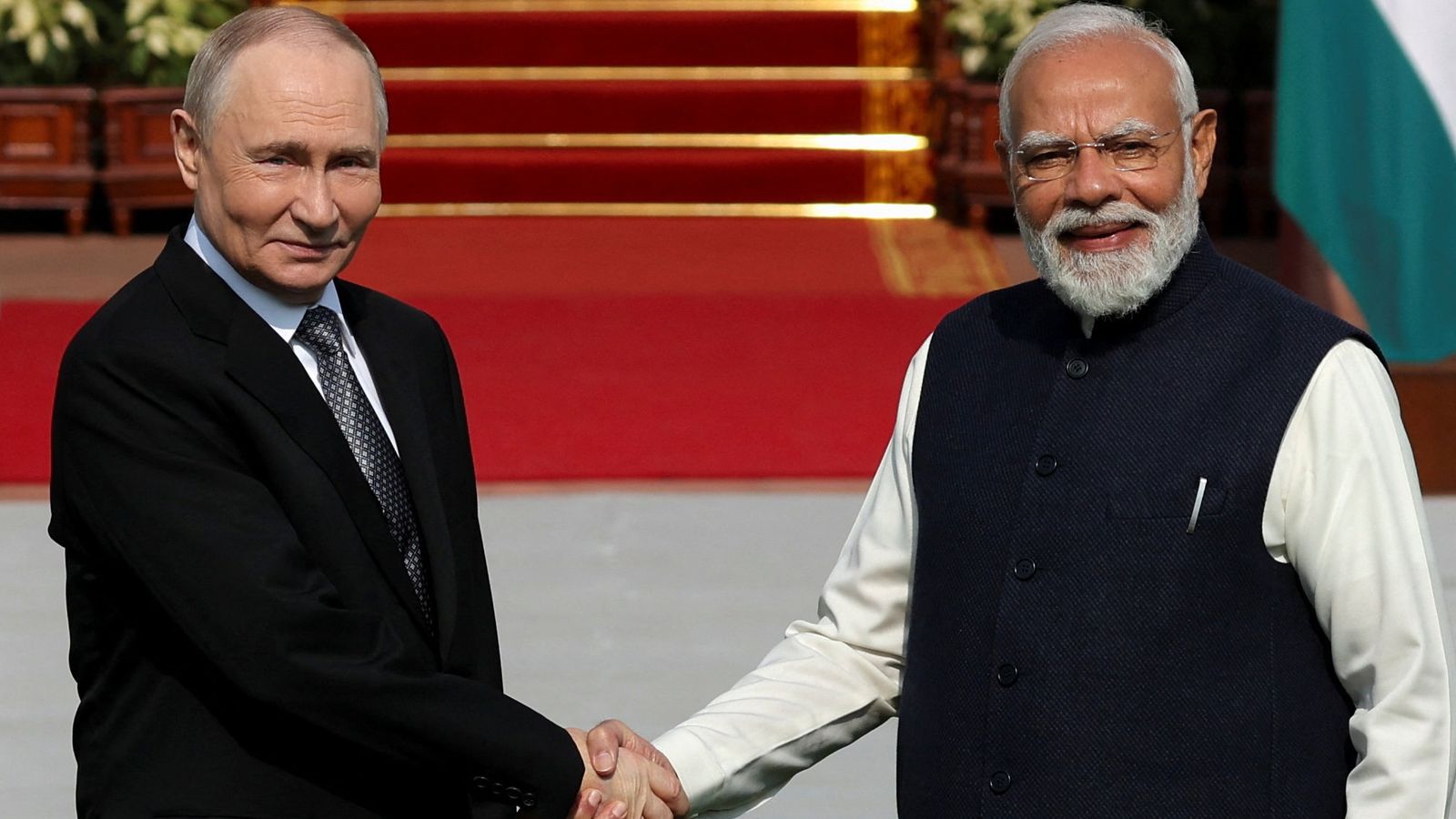 Vladimir Putin smiles as he meets Indian leader Narendra Modi | World News | Sky News