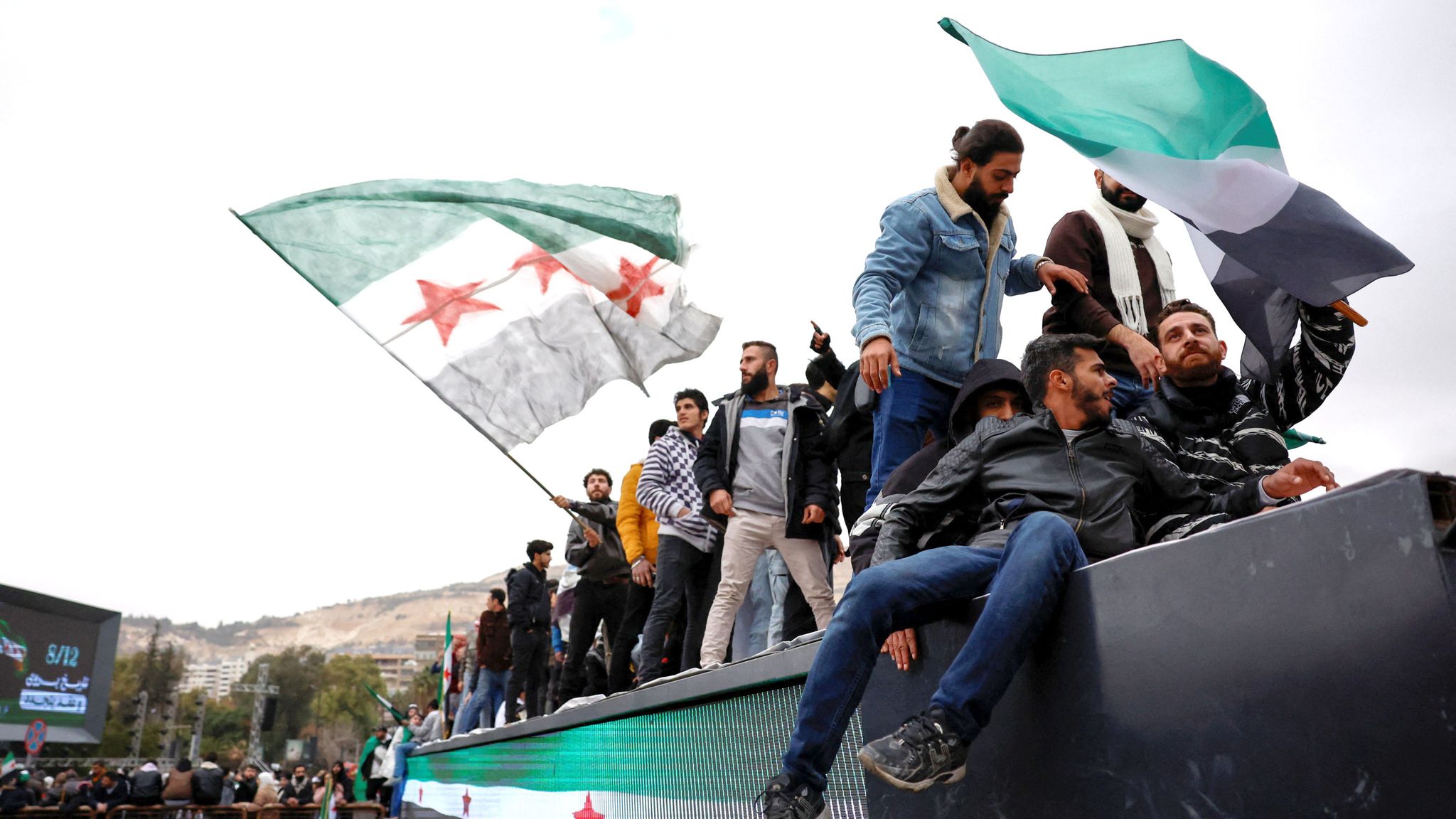 Syria jubilantly marks a year since Assad's fall with parades - and ...