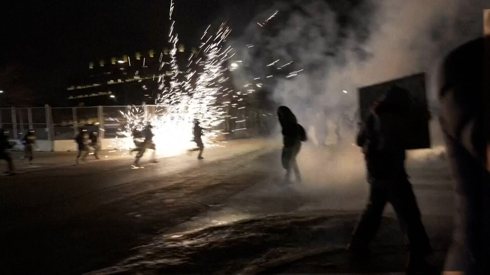 Moment federal agents throw flashbangs into crowd of protesters as ...