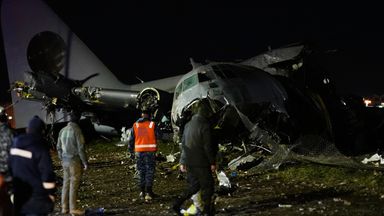 At least 15 killed after military plane crashes on to busy road in ...