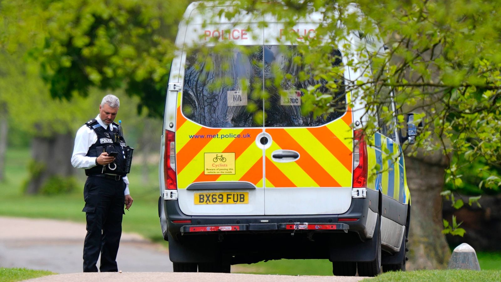 Police in protective clothing investigating 'ongoing incident' in ...