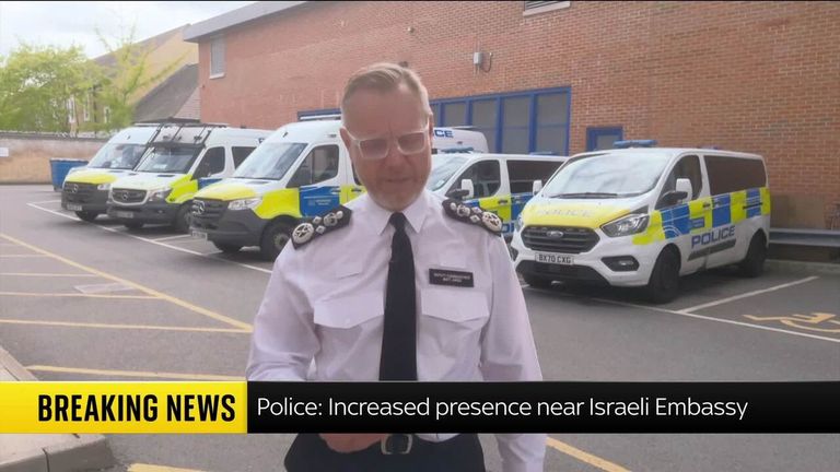 Police in protective clothing investigating 'ongoing incident' in ...