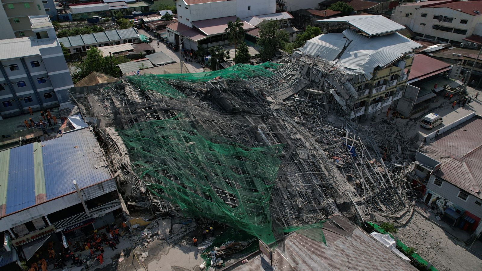 At least four dead and 17 missing after unfinished building collapses ...