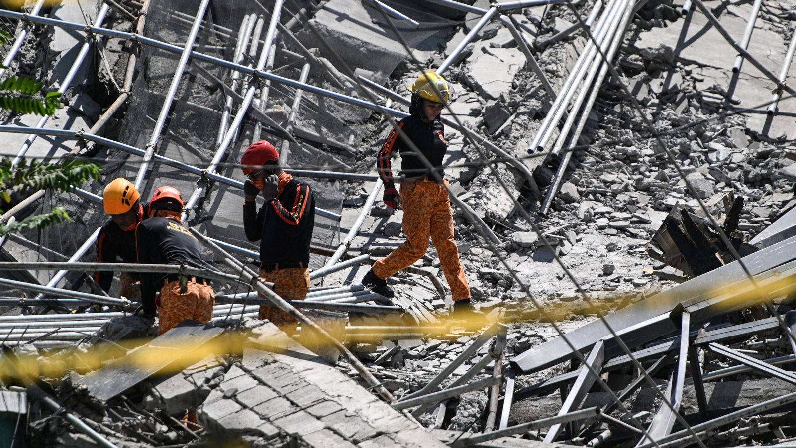 At least one dead and more than 20 missing after unfinished building ...