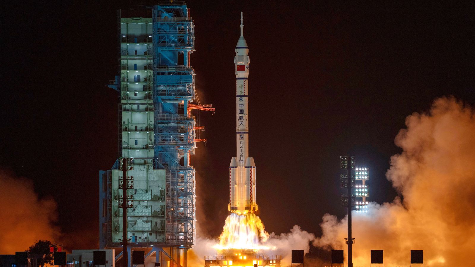 China launches three-astronaut rocket into space as new lunar race ...