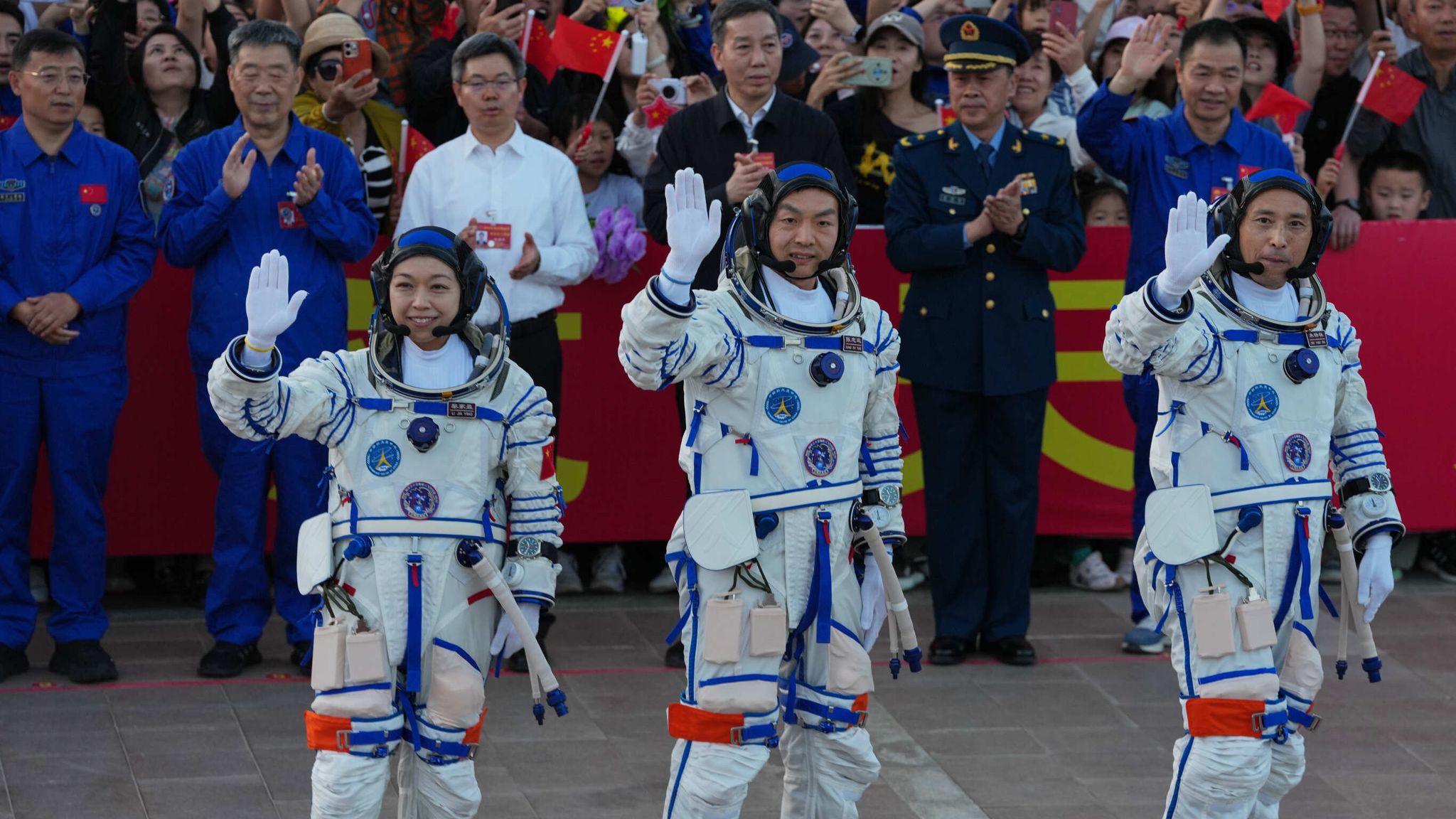 China launches three-astronaut rocket into space as new lunar race ...
