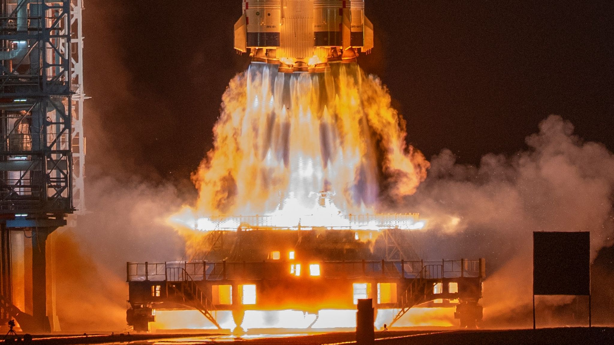 China launches three-astronaut rocket into space as new lunar race ...