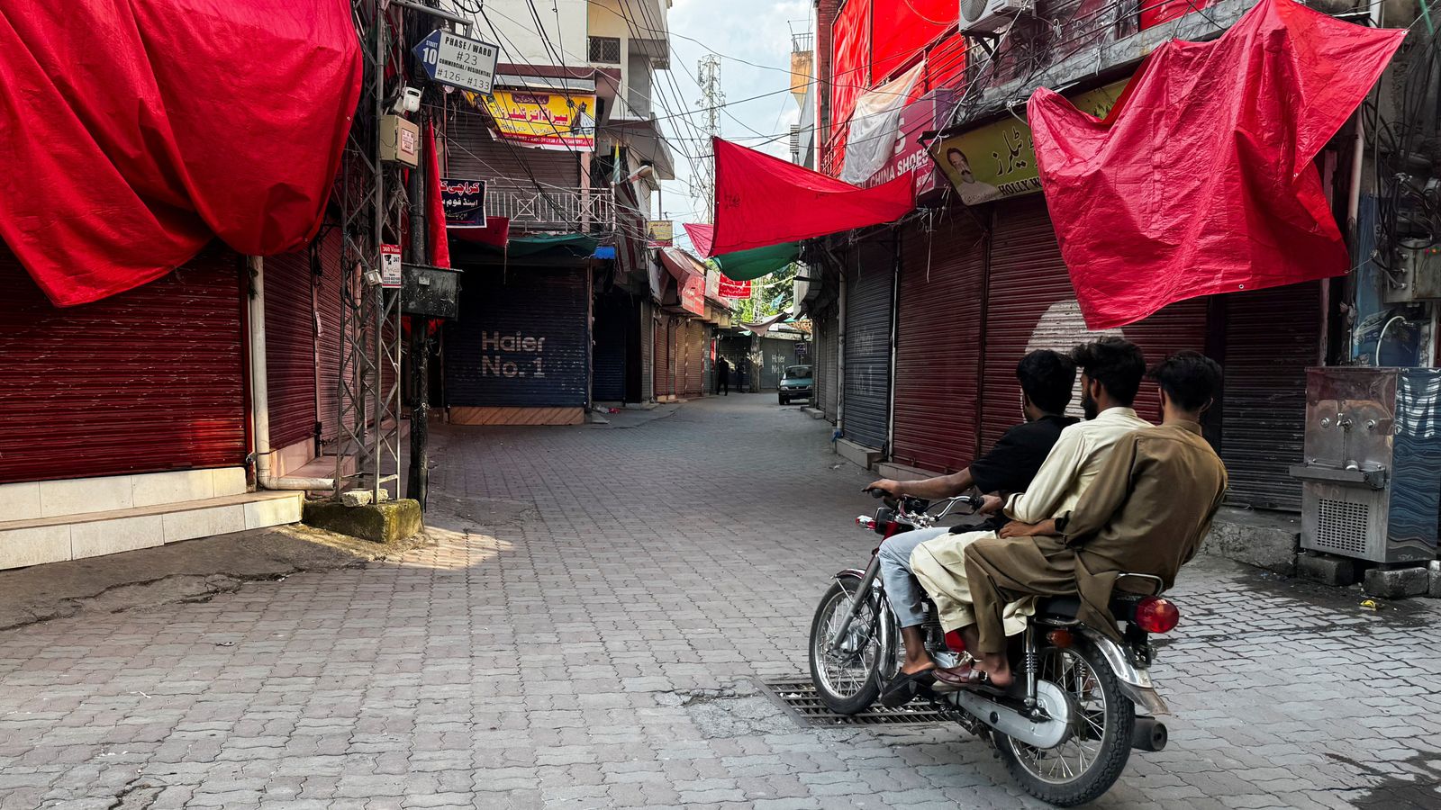 At least 24 killed in Pakistani Kashmir protests as roads closed, shops ...