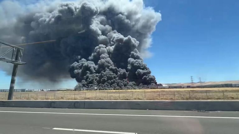 Plumes of smoke billow from massive warehouse fire in California | US ...