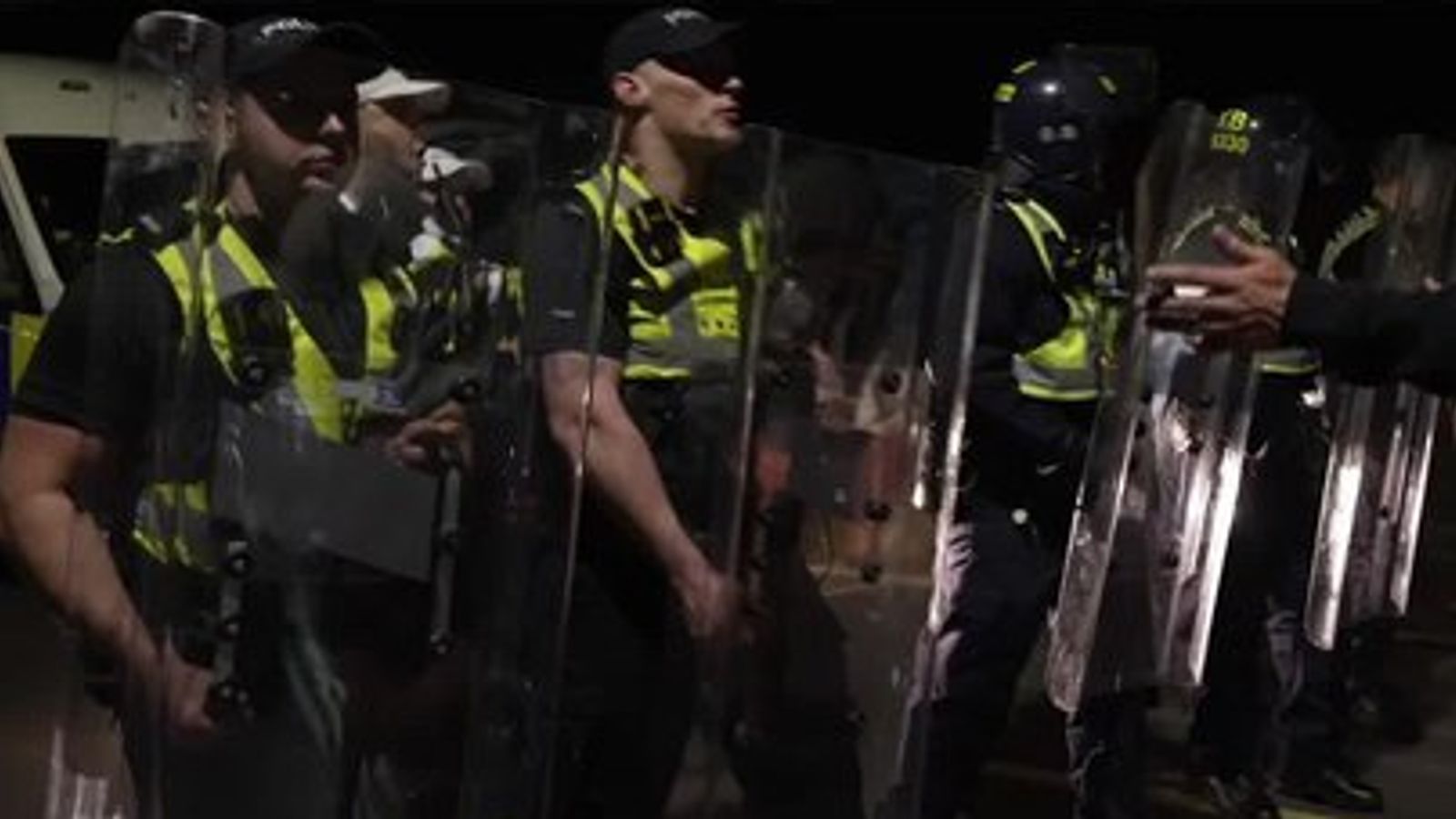 Clashes between police and protesters after small boat arrival | UK ...